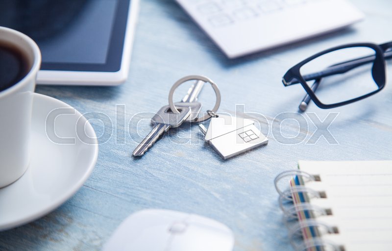 House keys on the desk with business ... | Stock image | Colourbox