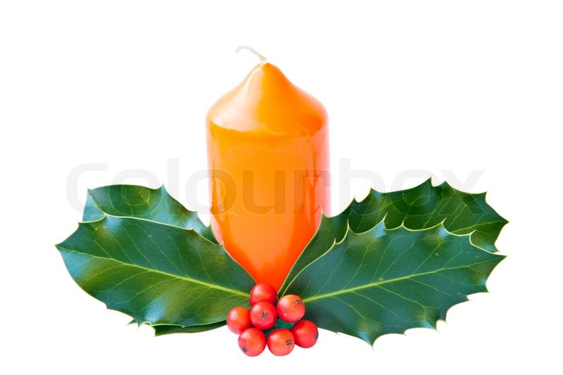 The candle is decorated with holly ... | Stock image | Colourbox