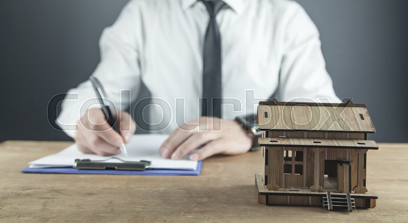 Real estate agent working in office. ... | Stock image | Colourbox