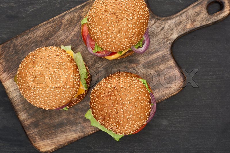 Top view of delicious fresh burgers on ... | Stock image | Colourbox