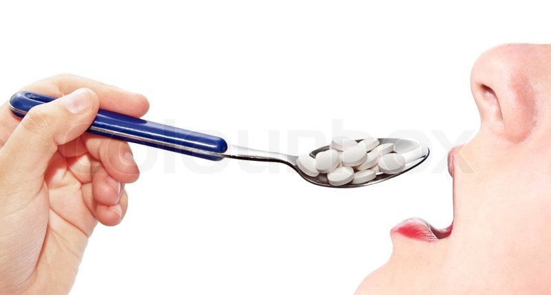 Woman eats pills | Stock image | Colourbox