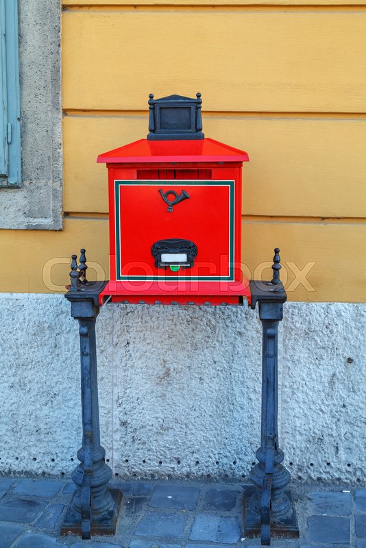 A beautiful retro red mailbox on metal ... | Stock image | Colourbox
