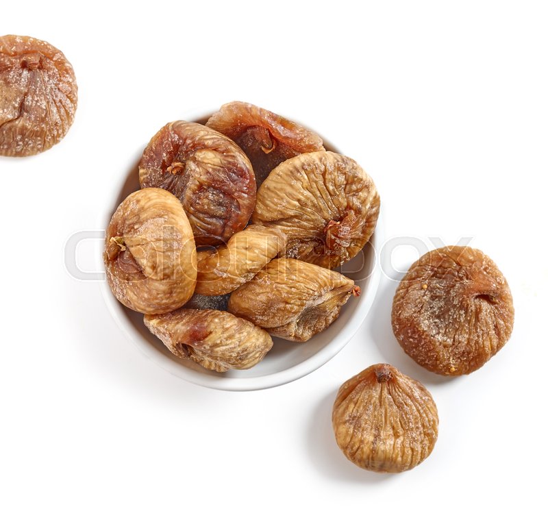 Bowl of dried figs isolated on white ... | Stock image | Colourbox