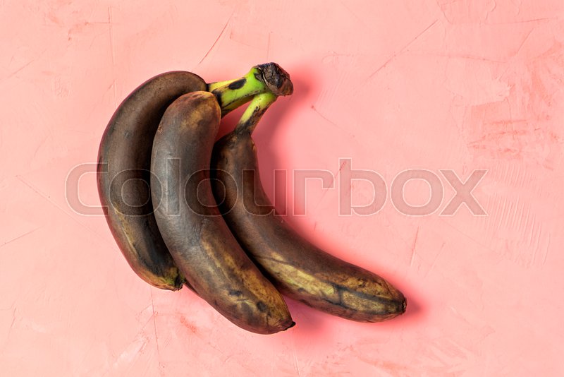 Ugly brown ripe bananas on a background ... | Stock image | Colourbox