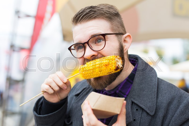 Man Eating Corn On The Cob