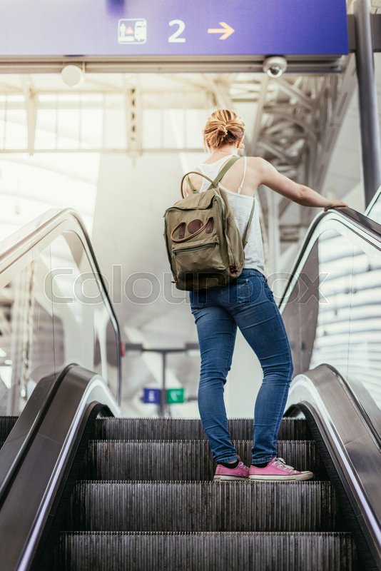 Young girl at the train station, ... | Stock image | Colourbox