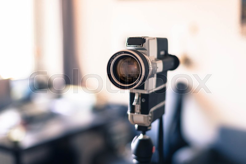Vintage old movie camera indoor, copy ... | Stock image | Colourbox