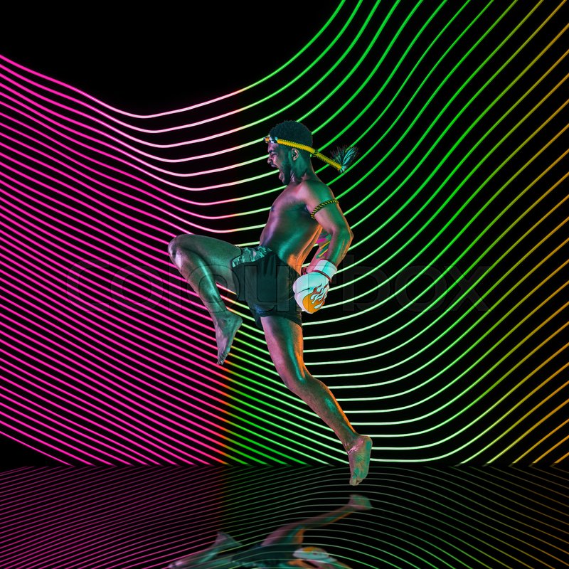 Creative sport on dark neon lighted ... | Stock image | Colourbox