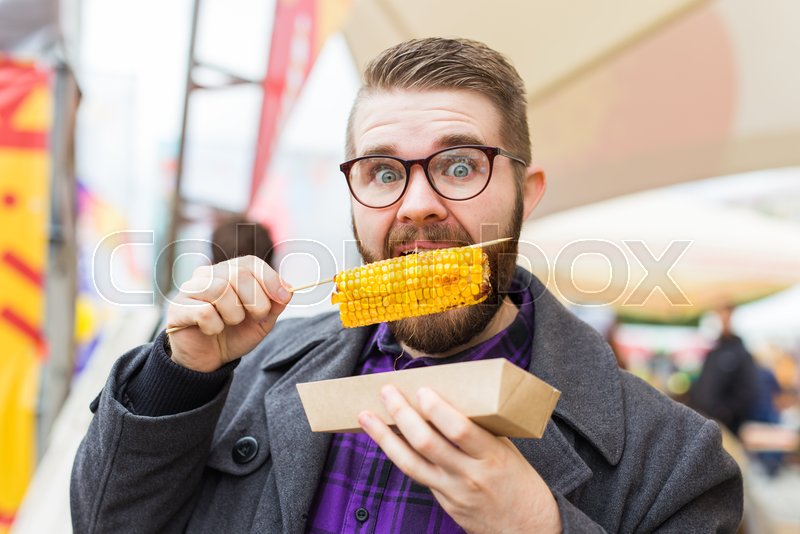Man Eating Corn On The Cob