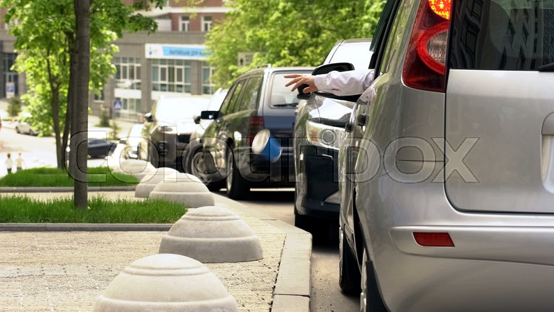 Driver throwing trash out of car ... | Stock image | Colourbox