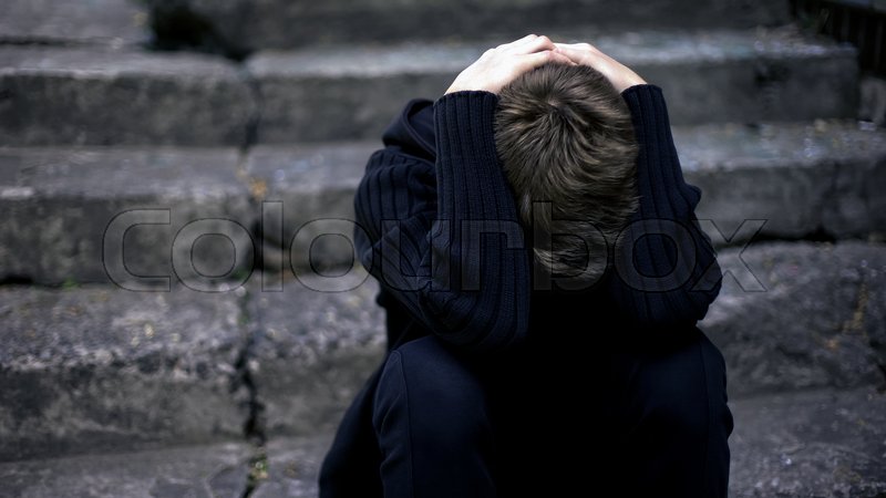 Lonely boy crying, sitting on old ... | Stock image | Colourbox