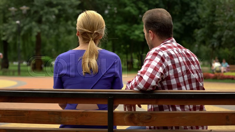 Woman Sitting On Bench Back View