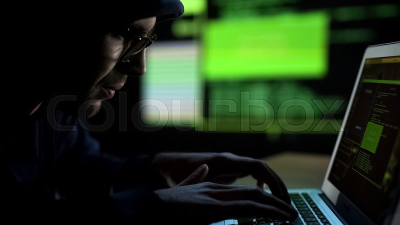 Programmer hacking security system, ... | Stock image | Colourbox