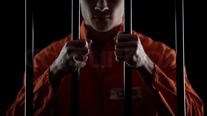 Aggressive inmate holding prison bars, ... | Stock image | Colourbox