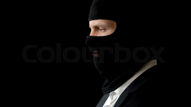 Gangster in suit and balaclava ready ... | Stock image | Colourbox