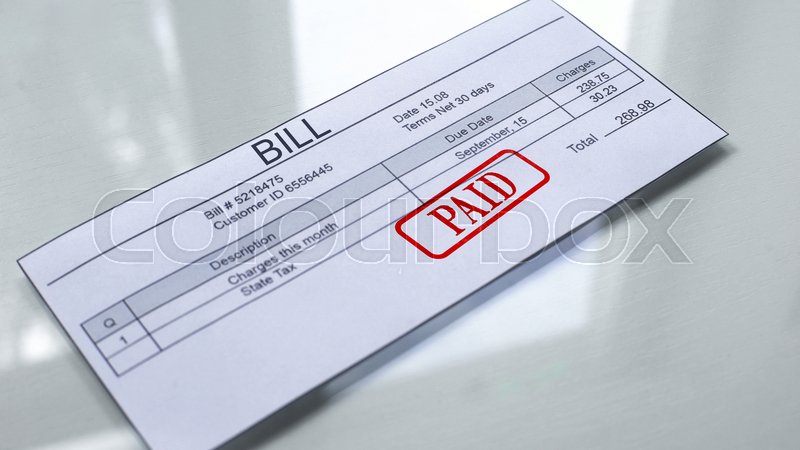 Paid seal stamped on bill, payment for ... | Stock image | Colourbox