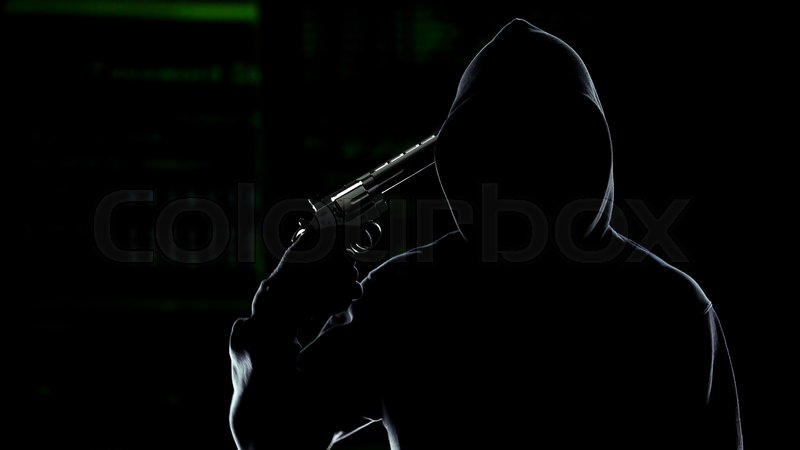 Hacker silhouette pointing gun to his ... | Stock image | Colourbox