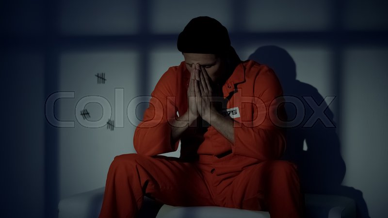 Depressed Caucasian prisoner feeling ... | Stock image | Colourbox