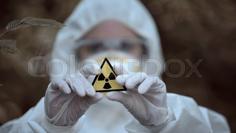 Radiation sign scientist hands, ... | Stock image | Colourbox