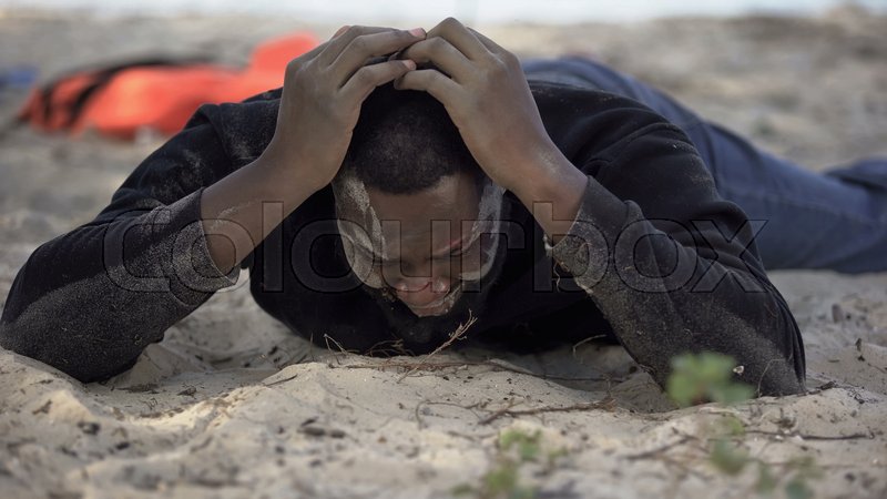 Desperate afro-american man crying on ... | Stock image | Colourbox