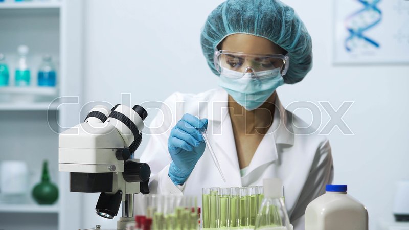 Laboratory worker collecting biological ... | Stock image | Colourbox