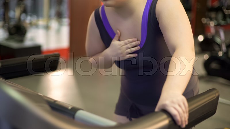 Overweight lady suffering heart pain ... | Stock image | Colourbox