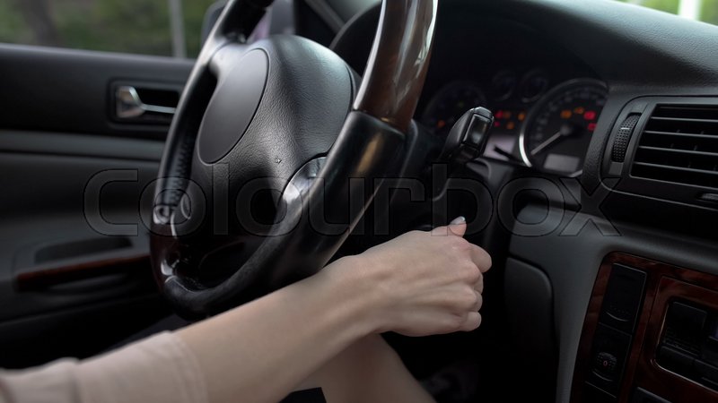 Female hand starting car engine, ... | Stock image | Colourbox