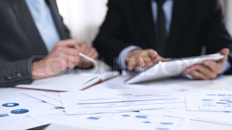 Business partners exchanging ideas ... | Stock image | Colourbox
