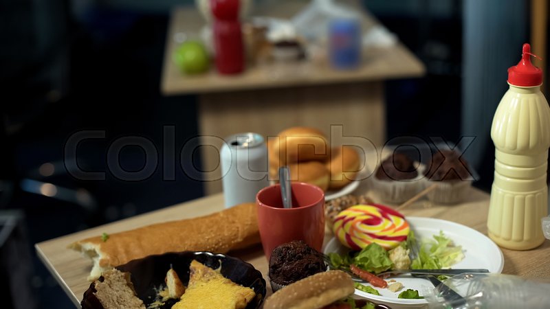 Dirty plates full of greasy junk food ... | Stock image | Colourbox
