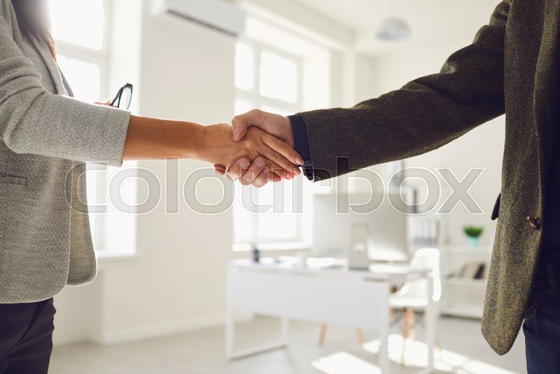 Handshake of businessmen. Female and ... | Stock image | Colourbox