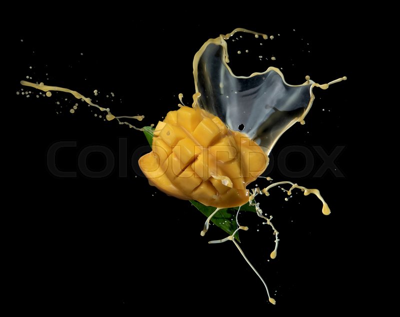 Mango slice and mango juice splash wave ... | Stock image | Colourbox