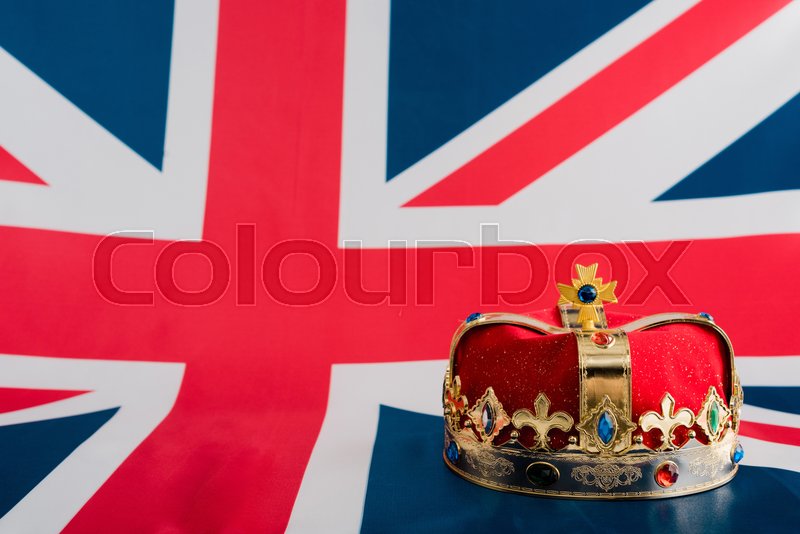 Golden crown on british flag with copy ... | Stock image | Colourbox
