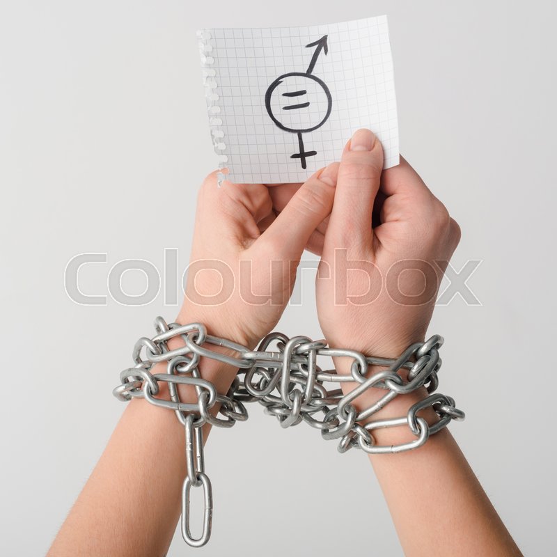 Cropped view of woman in chains holding ... | Stock image | Colourbox