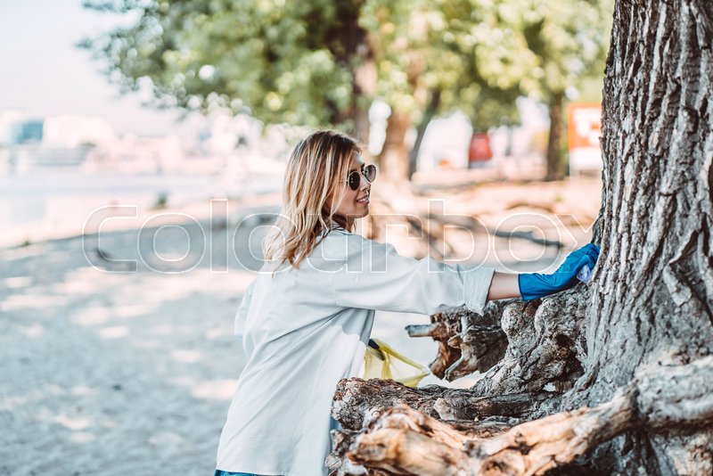 Girl Picking Up Trash From The Park Stock Image Colourbox