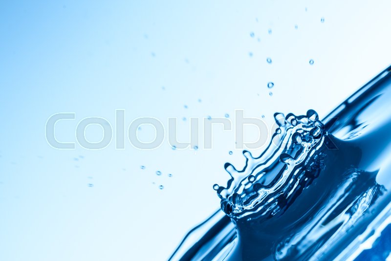 Water drop fall into water | Stock image | Colourbox