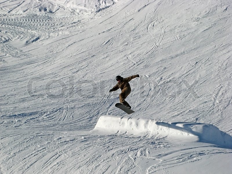 Snowboarder at jump | Stock Photo | Colourbox