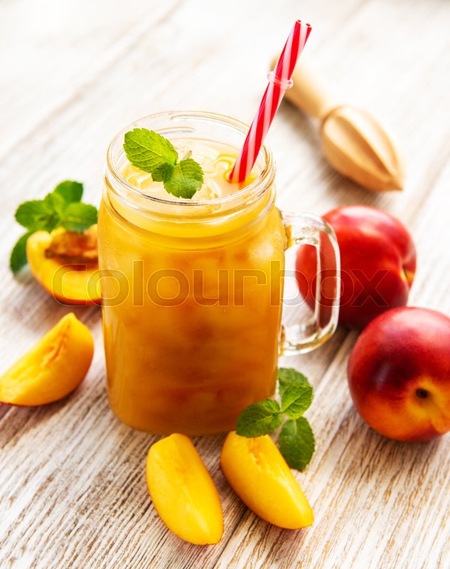 Nectarine juice with fresh fruits on a ... | Stock image | Colourbox