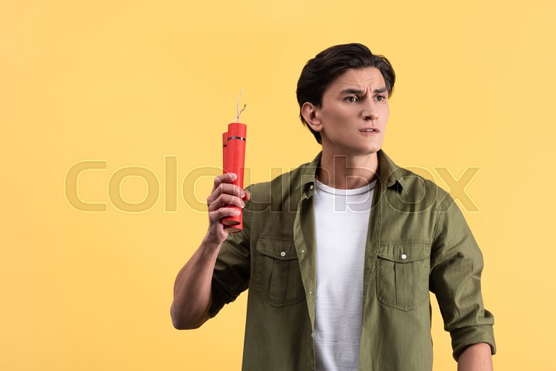 Stressed young man holding dynamite, ... | Stock image | Colourbox