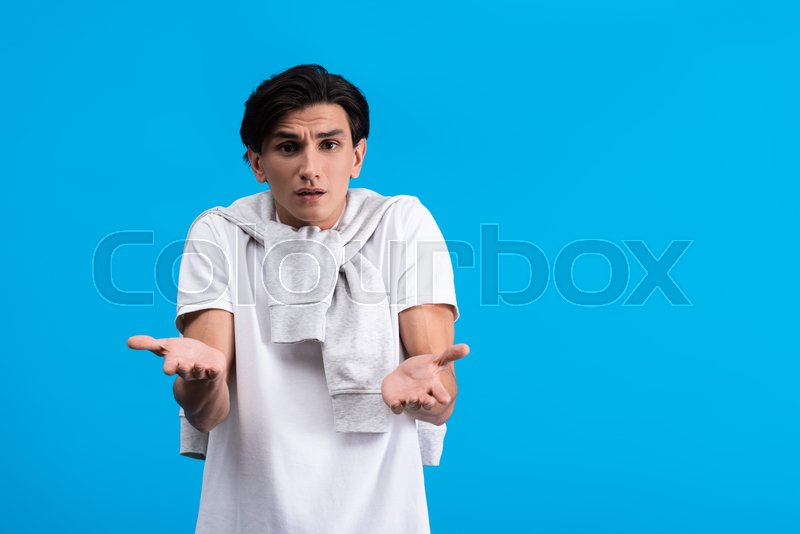 Frustrated man with shrug gesture, ... | Stock image | Colourbox
