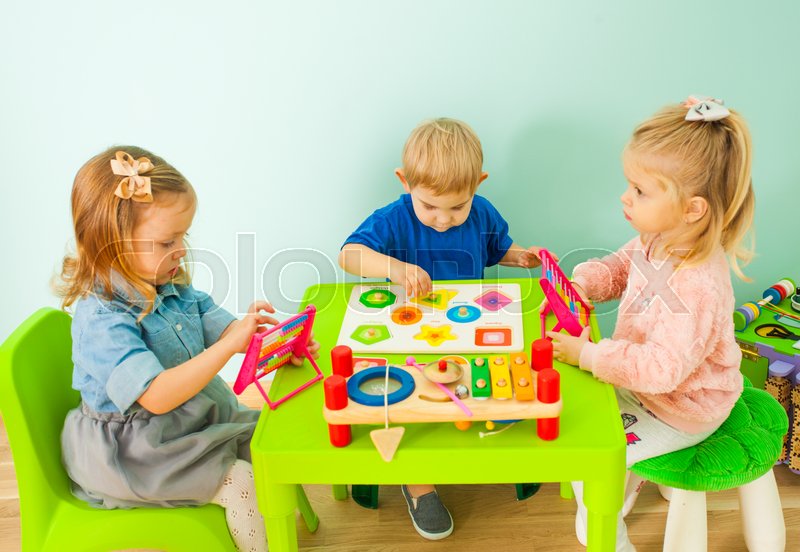 Happy children playing with colorful ... | Stock image | Colourbox