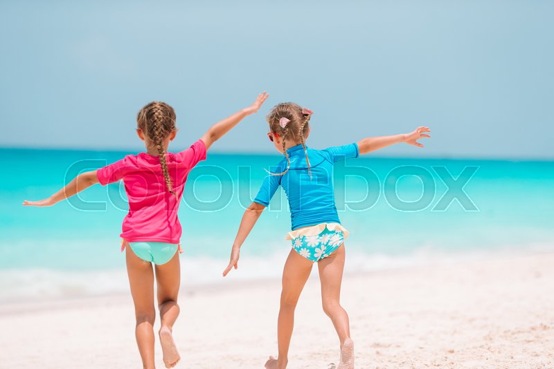 Little girls having fun at tropical ... | Stock image | Colourbox