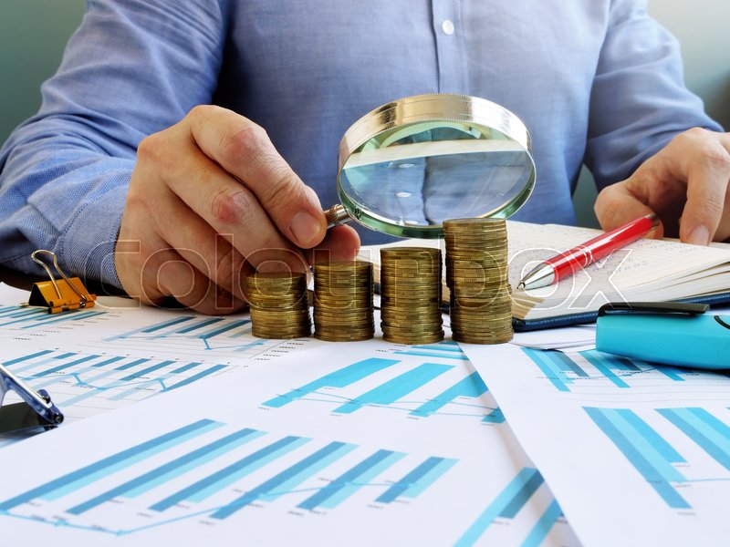 Auditor makes financial audit and ... | Stock image | Colourbox