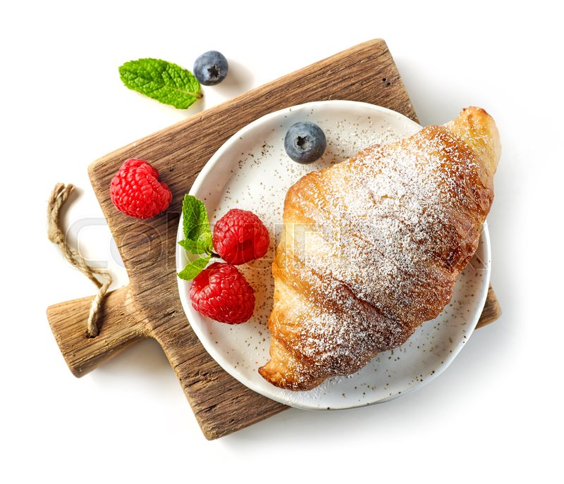 Freshly baked sweet croissant decorated ... | Stock image | Colourbox
