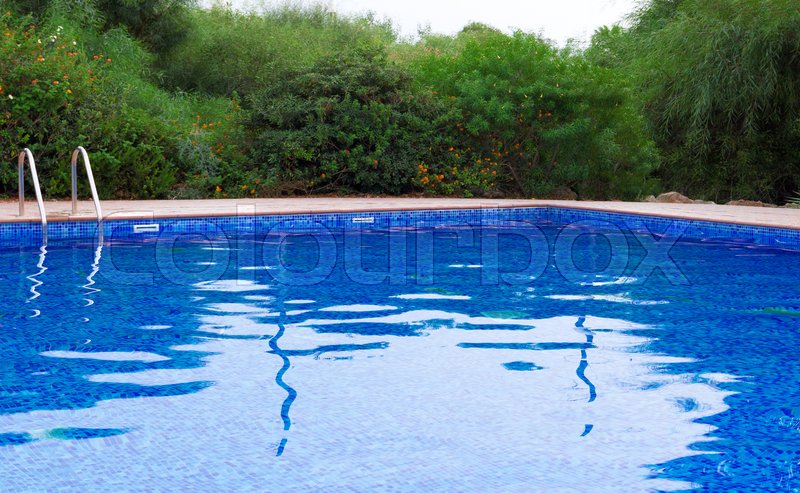 Outdoor swimming pool at summer time. | Stock image | Colourbox