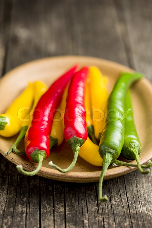 Different colors chilli peppers with ... | Stock image | Colourbox