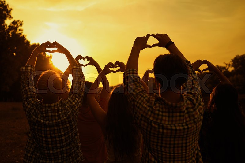 A heart made by the hands of a group of ... | Stock image | Colourbox