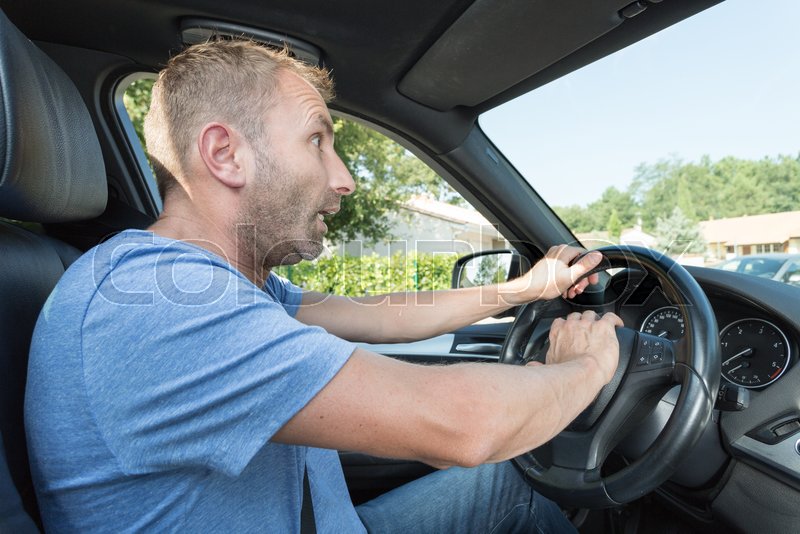 Furious male driver honking the car ... | Stock image | Colourbox