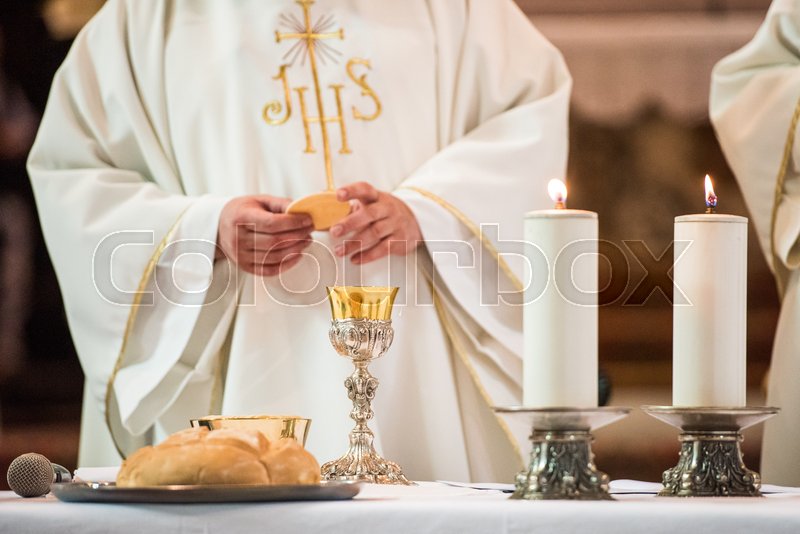 Minister showing the holy bread during ... | Stock image | Colourbox