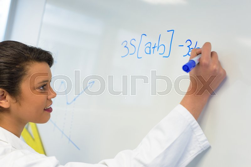 Woman during a math lesson | Stock image | Colourbox