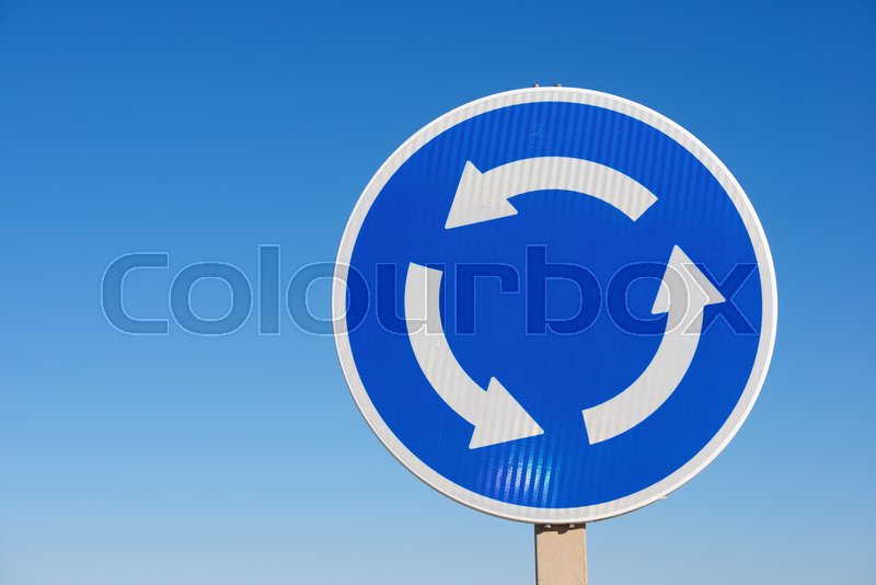 Roundabout traffic sign and clear sky ... | Stock image | Colourbox